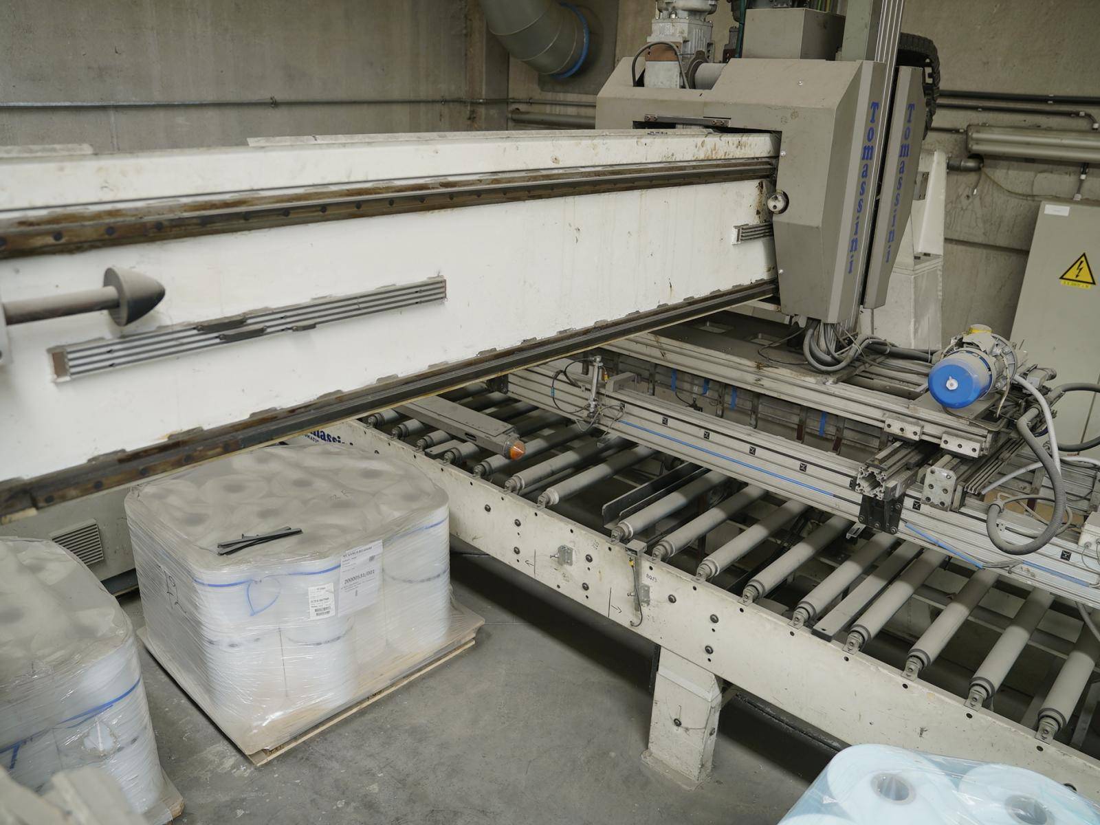 Stacking and destacking device Stacking and destacking device TOMASSINI ...